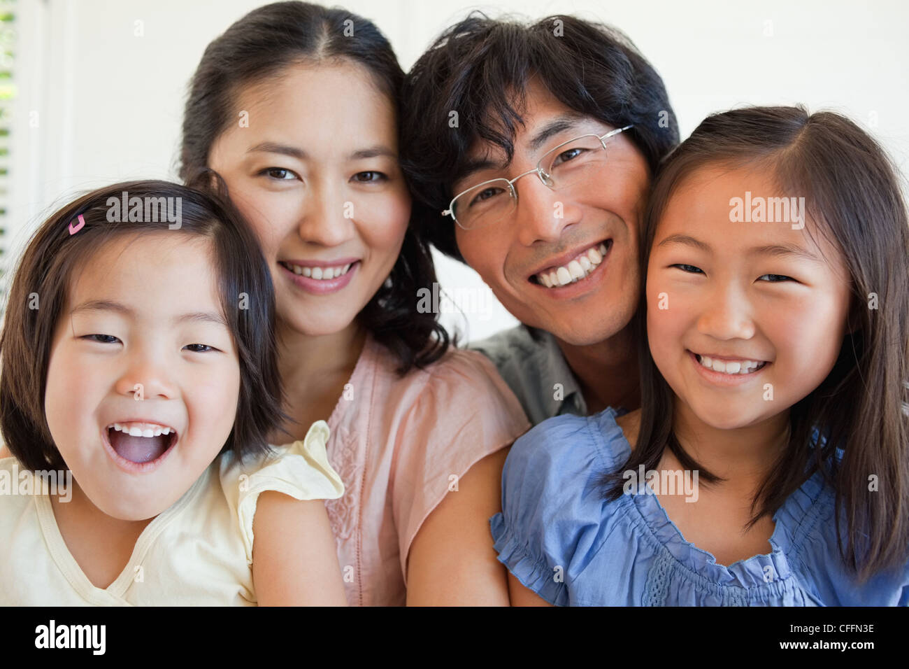 Close up of the posing family Stock Photo - Alamy