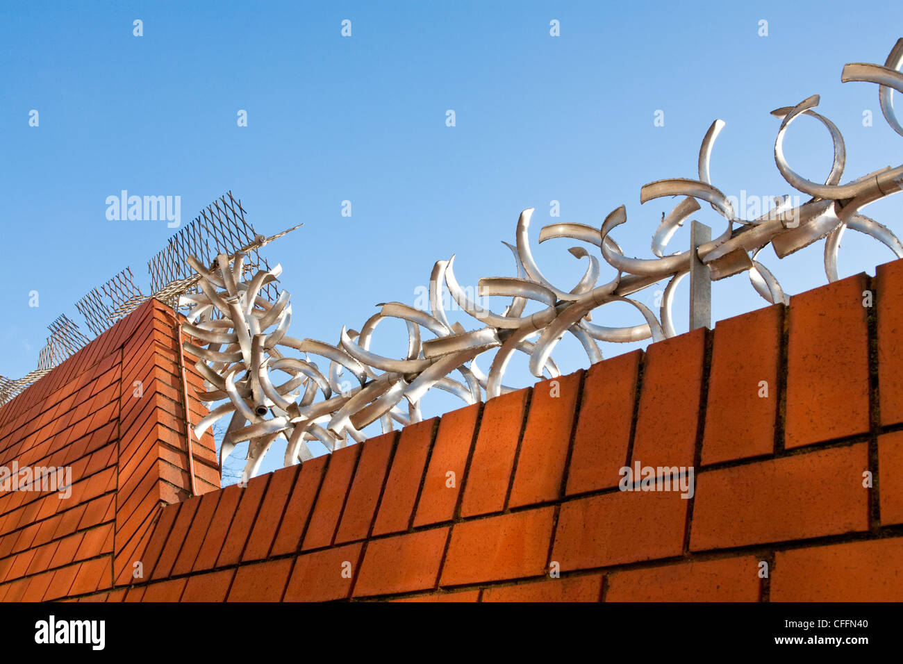 Security wall and metal fence Stock Photo - Alamy