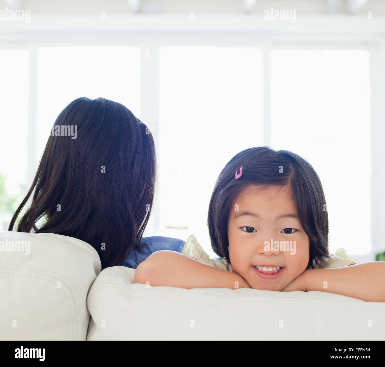 One girl faces forward while the other faces back Stock Photo - Alamy