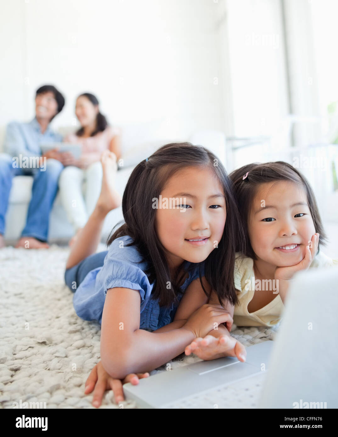Asian parents watch kids hi-res stock photography and images - Alamy