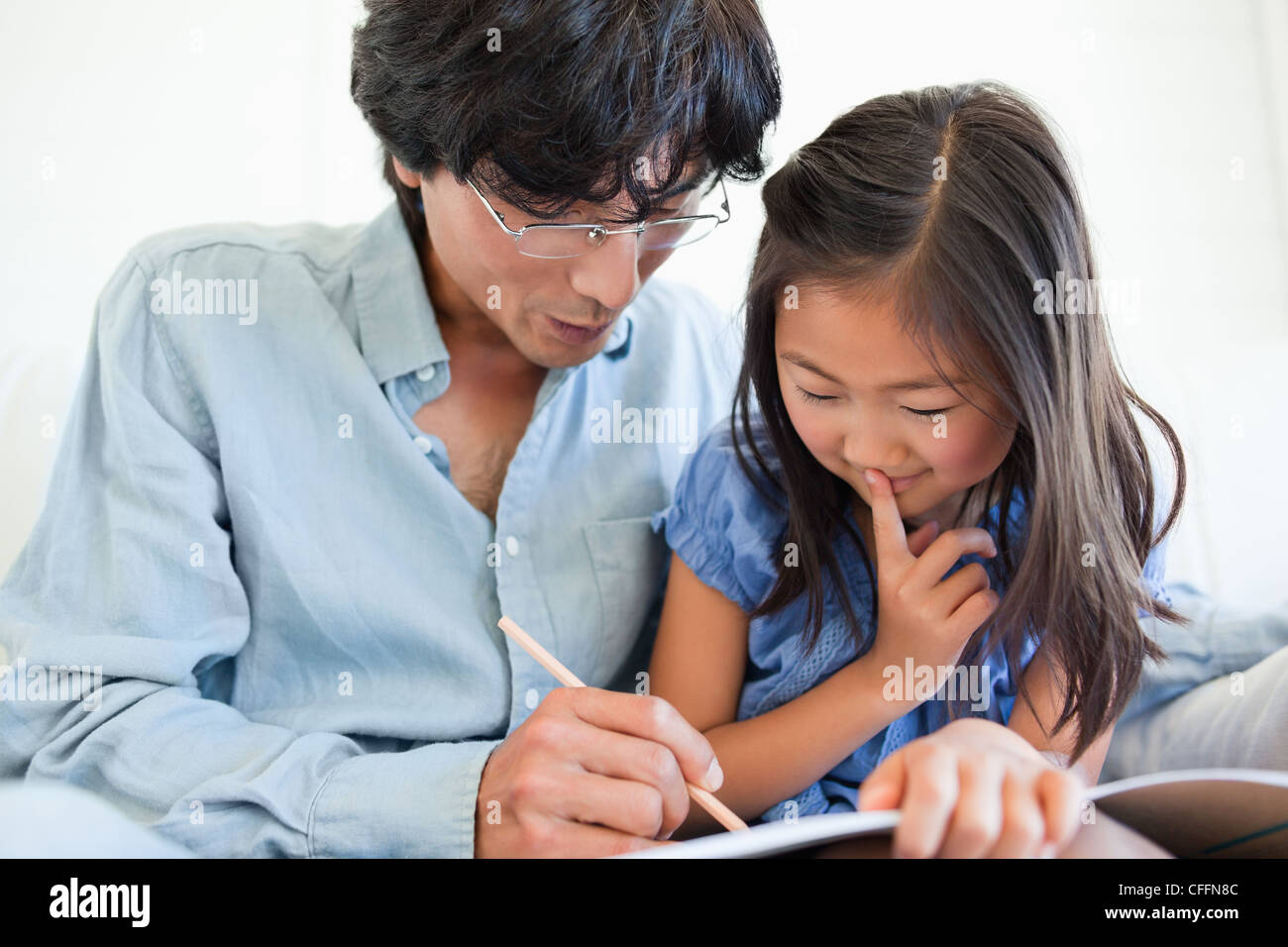 A father and daughter study together Stock Photo - Alamy