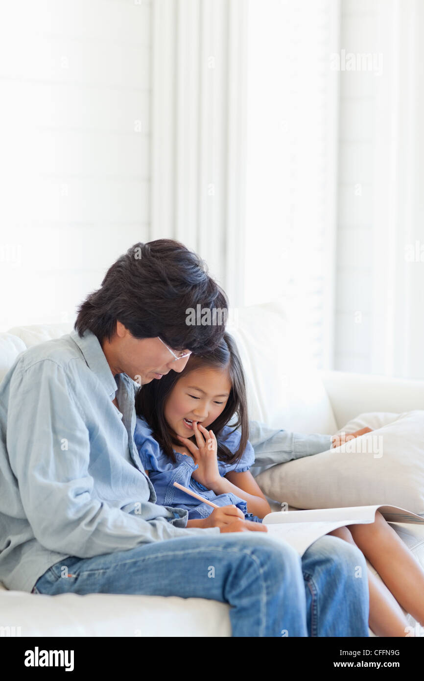 Dad and his daughter doing homework together Stock Photo - Alamy
