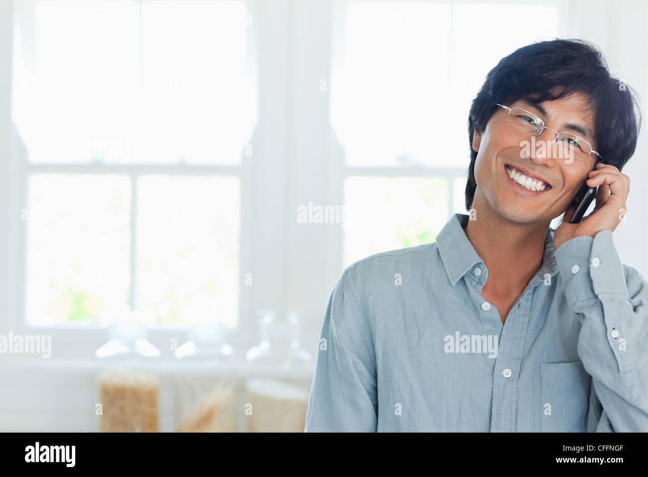 A smiling man looks straight ahead Stock Photo - Alamy