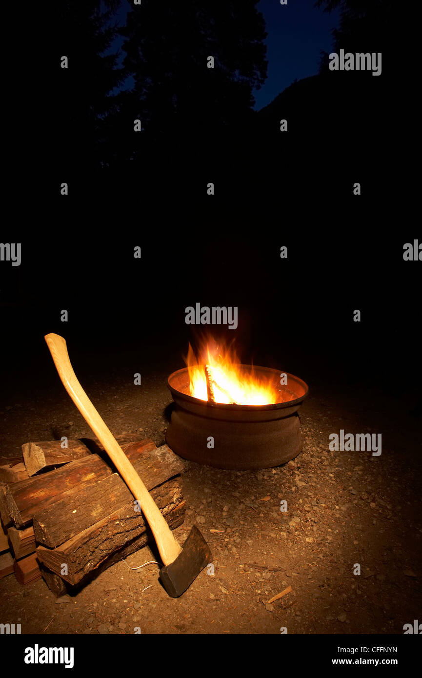 Camp Fire Pit with Wood Stack and Axe, British Columbia Stock Photo - Alamy