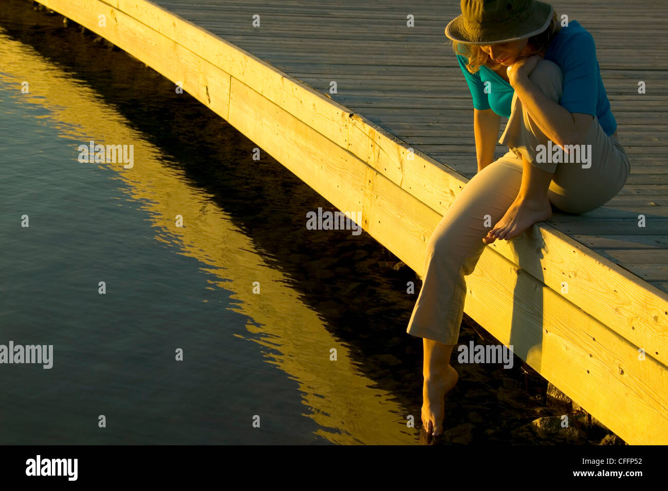 Woman Sitting on Boardwalk, Toronto, Ontario Stock Photo - Alamy