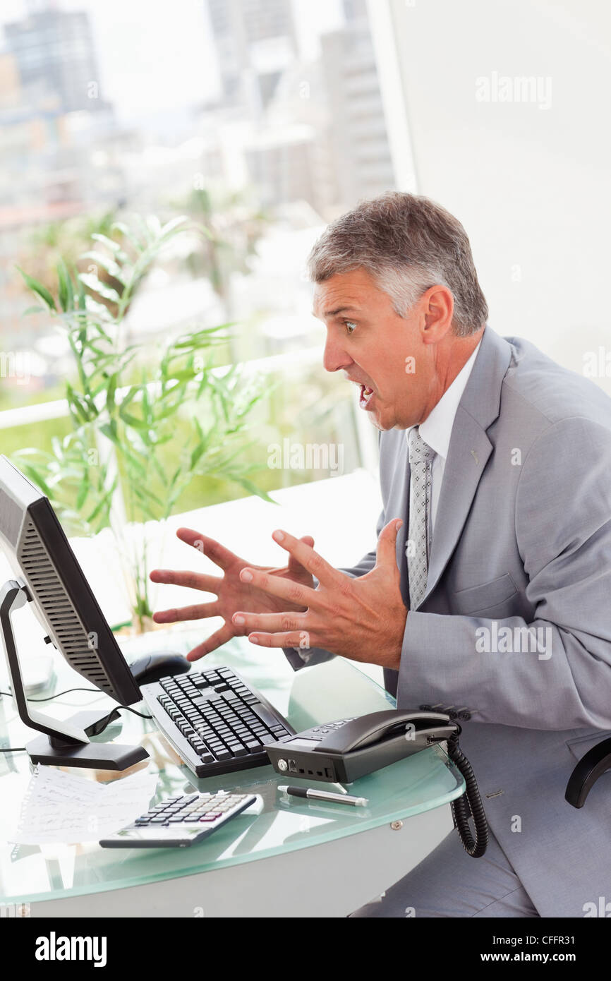 Businessman losing all his files on his computer Stock Photo - Alamy
