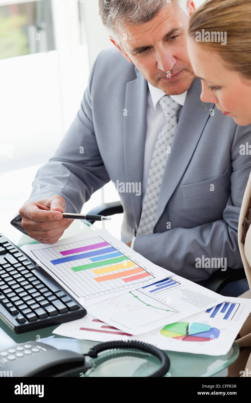 Business people working on statistic Stock Photo - Alamy