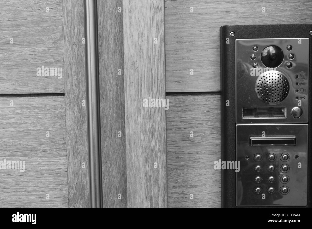 Intercom on wooden door Stock Photo - Alamy
