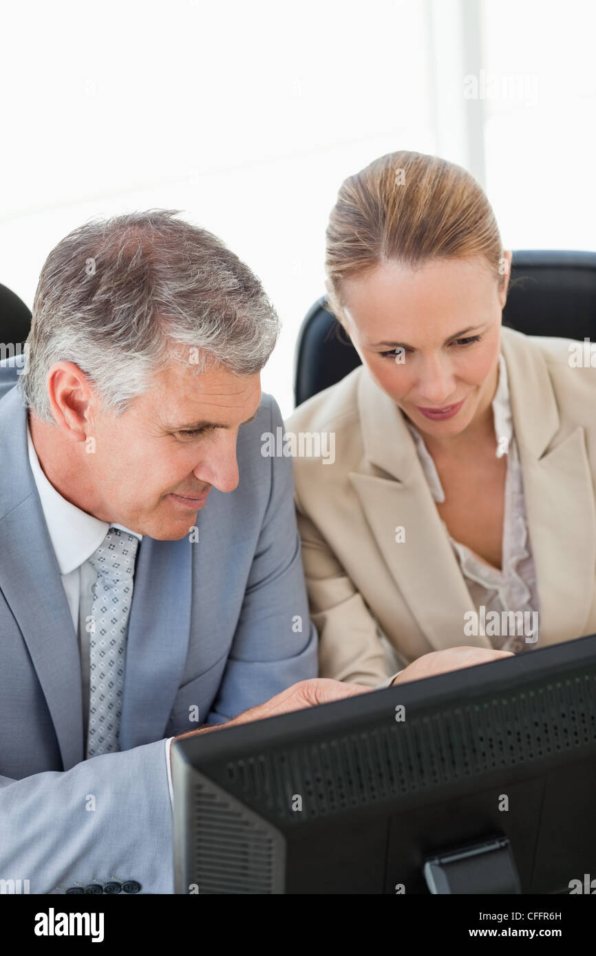 Business people with a computer Stock Photo - Alamy