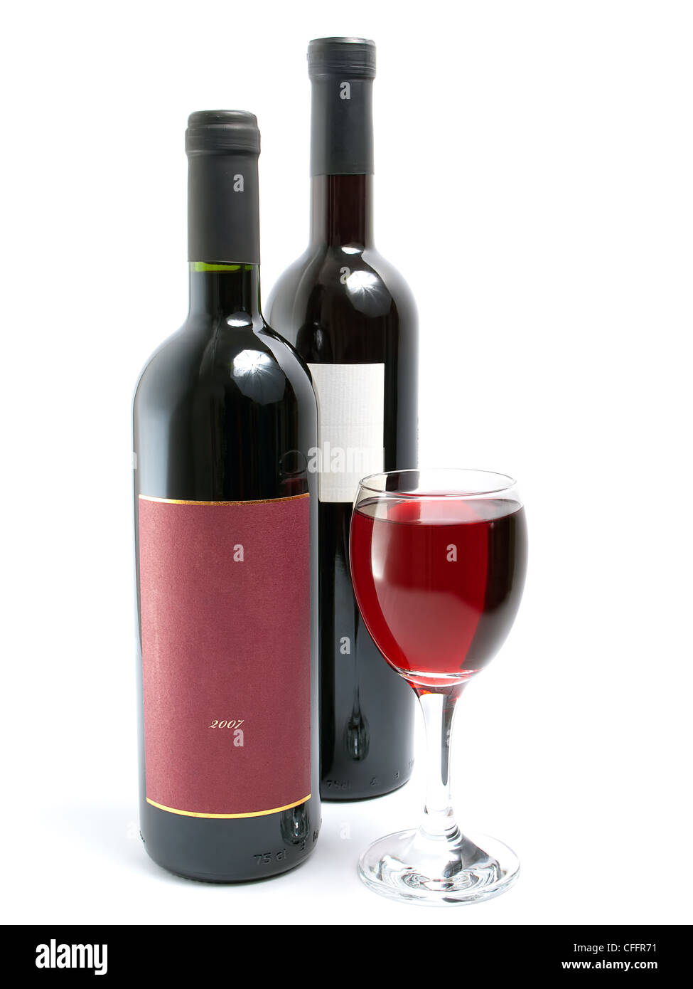 Glass full of red wine and two bottles of wine on a white background ...