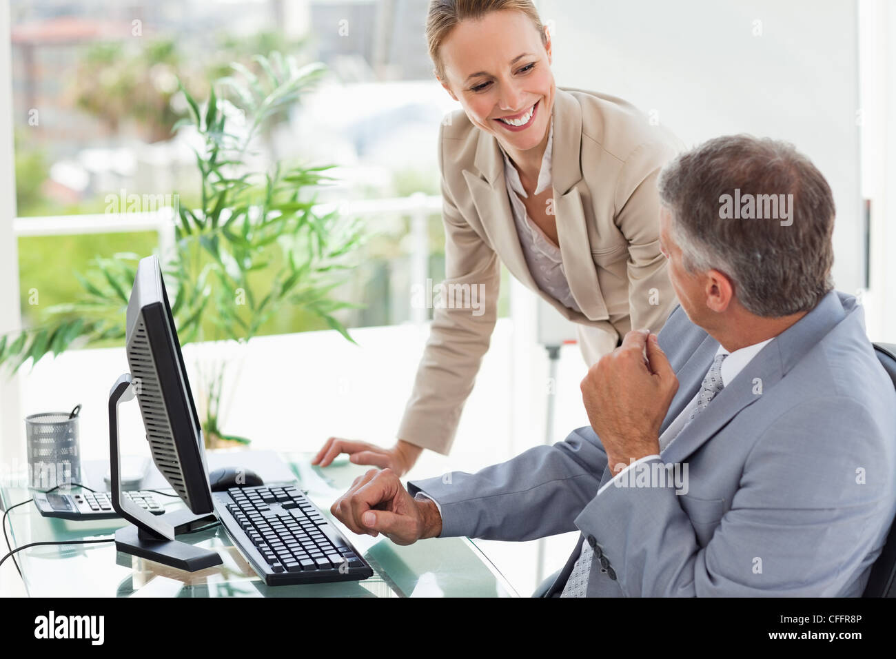 Company people smiling Stock Photo - Alamy