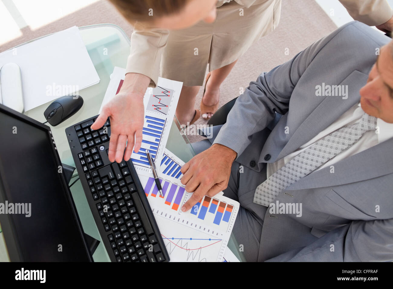 High angle-shot of business people working on diagrams Stock Photo - Alamy