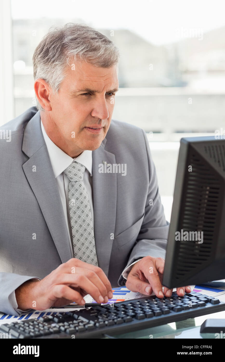 Boss working at his desk Stock Photo - Alamy