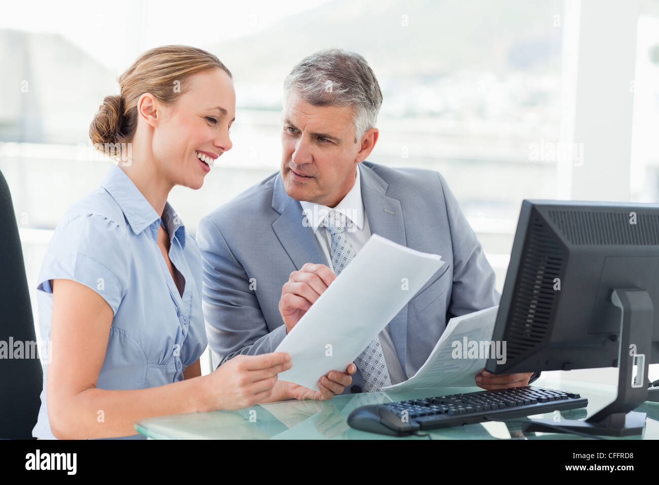 Boss giving files employee hi-res stock photography and images - Alamy