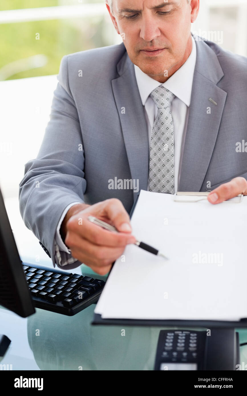 Boss showing a file Stock Photo - Alamy