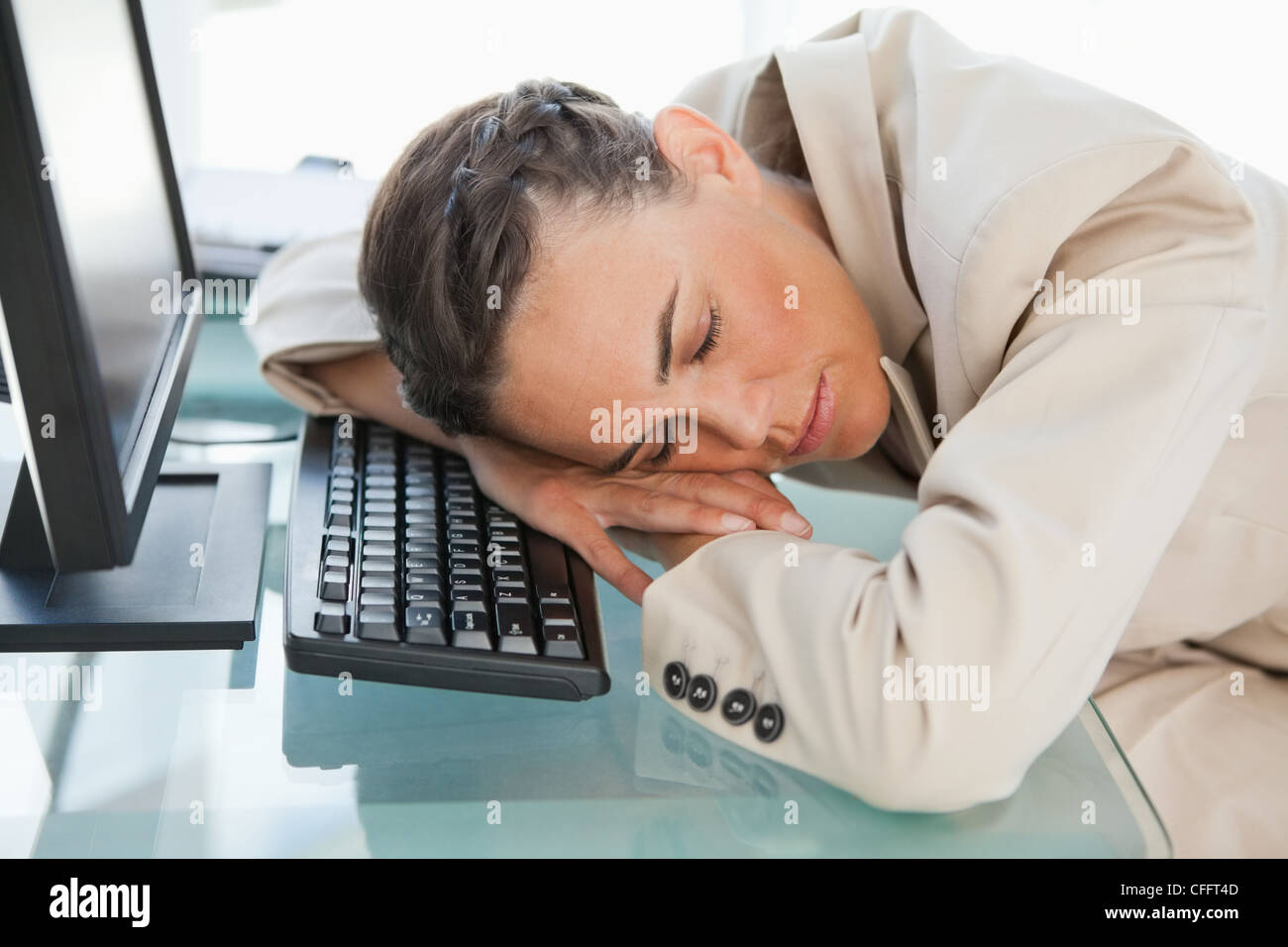 Businesswoman sleeping on her keyboard Stock Photo - Alamy