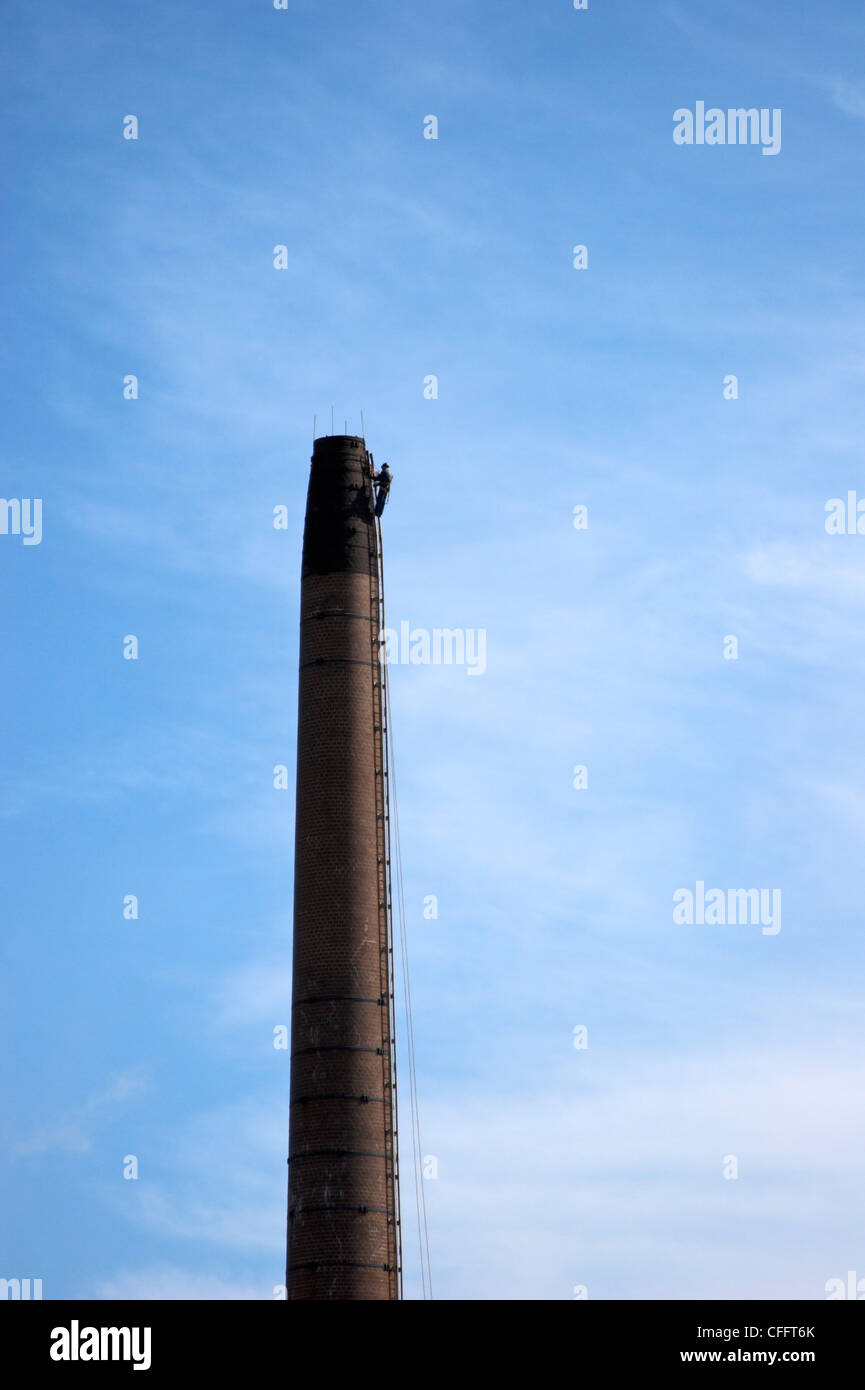 Man Climbing Smoke Stack Stock Photo - Alamy