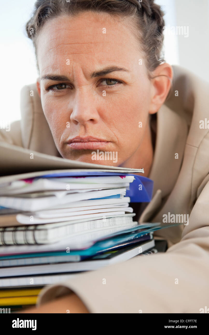 Businesswoman getting a lot of files Stock Photo - Alamy