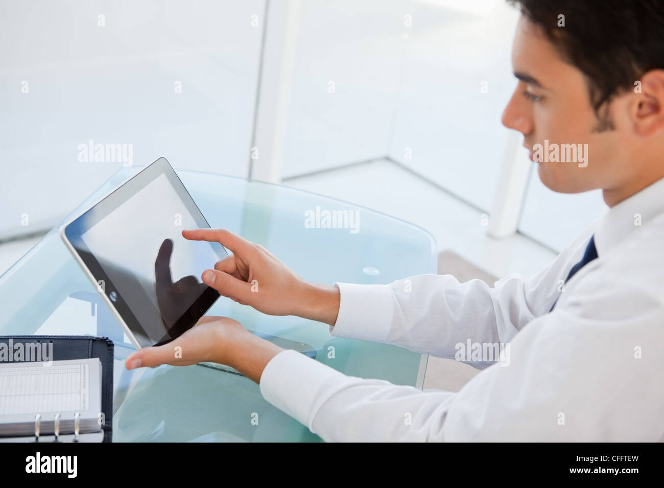Businessman using a touch pad Stock Photo - Alamy