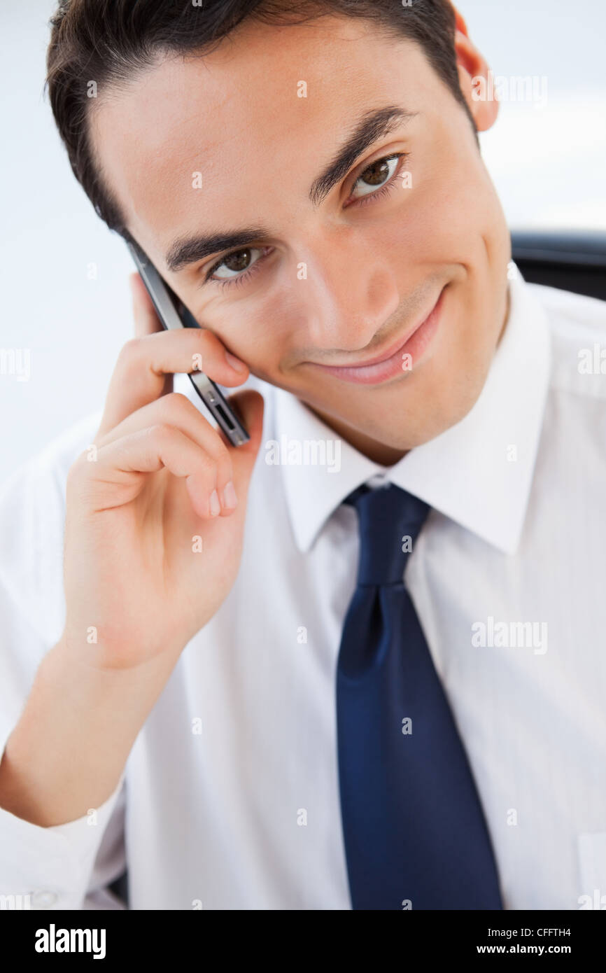 Portrait of a handsome man in suit calling with his smartphone Stock ...