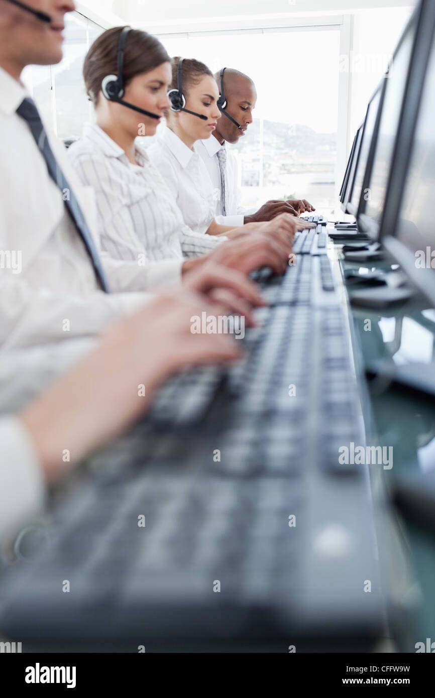 Business team working hard on computers Stock Photo - Alamy