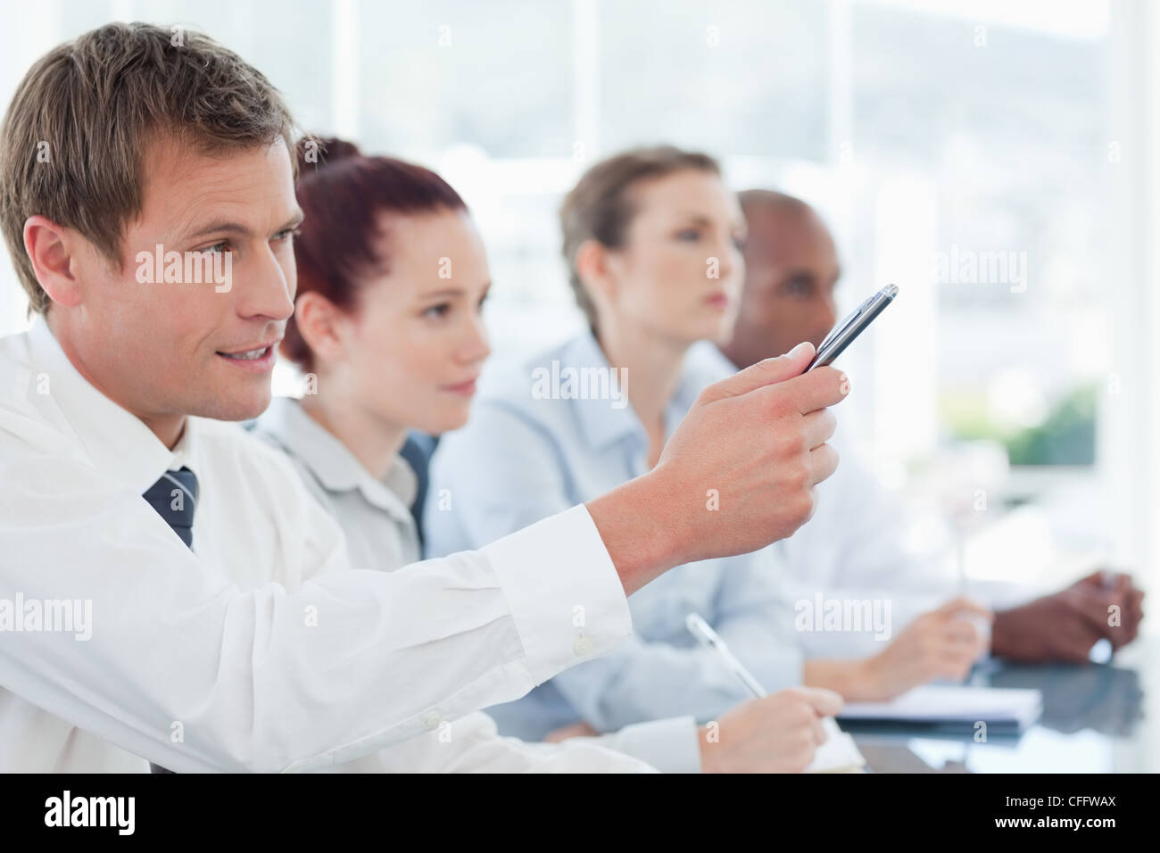 Salesman talking in a meeting Stock Photo - Alamy