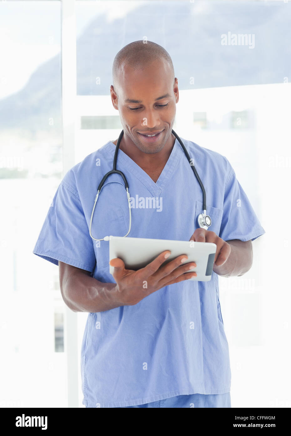Doctor using tablet computer Stock Photo - Alamy