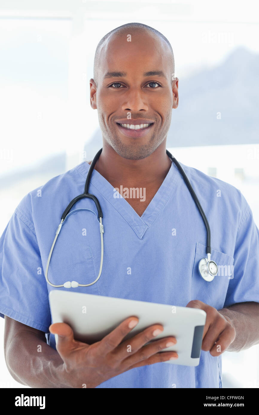 Doctor with tablet computer Stock Photo - Alamy