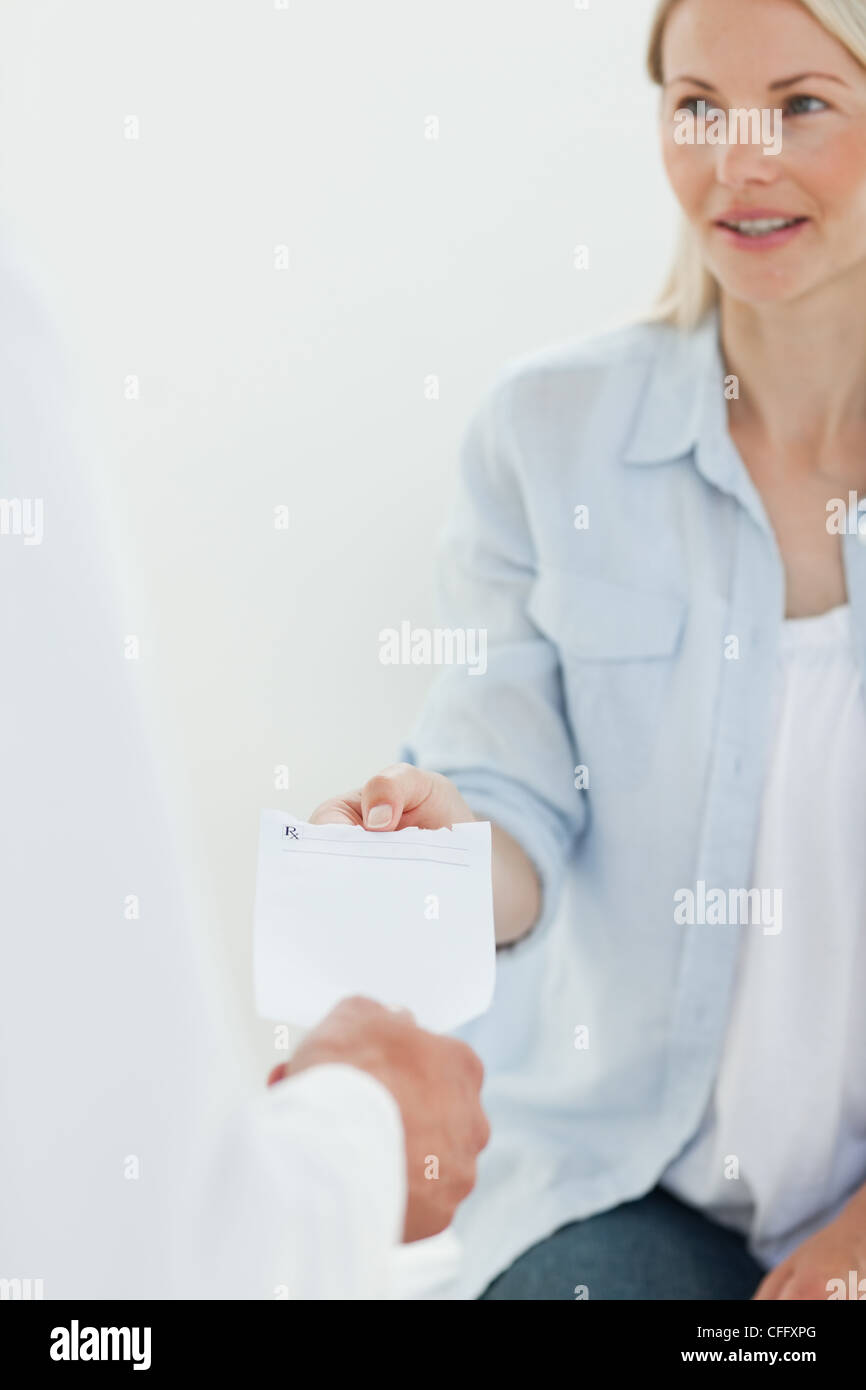 Patient getting prescription from her doctor Stock Photo - Alamy