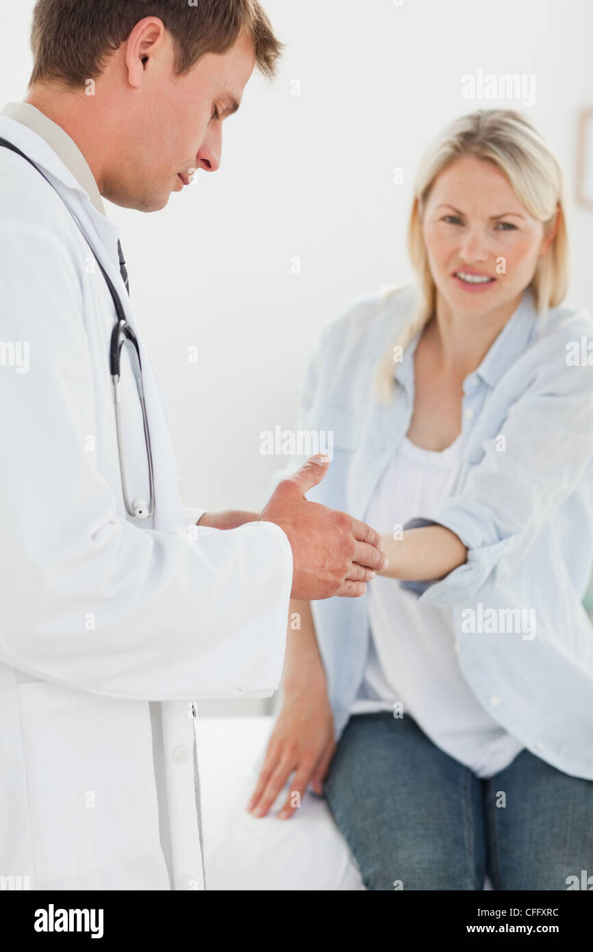 Doctor checking his patients wrist Stock Photo - Alamy