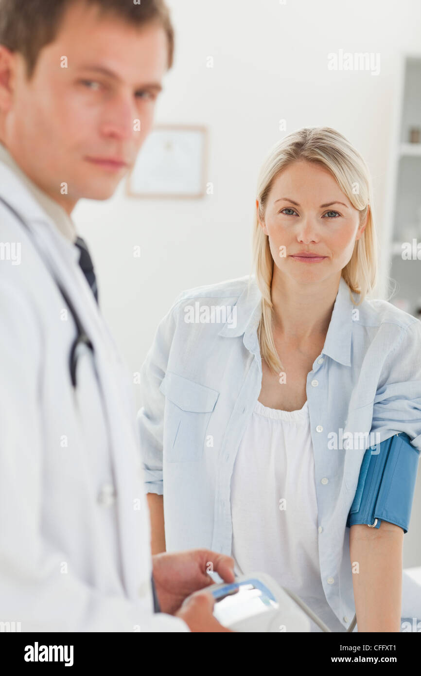 Woman getting blood pressure checked hi-res stock photography and ...