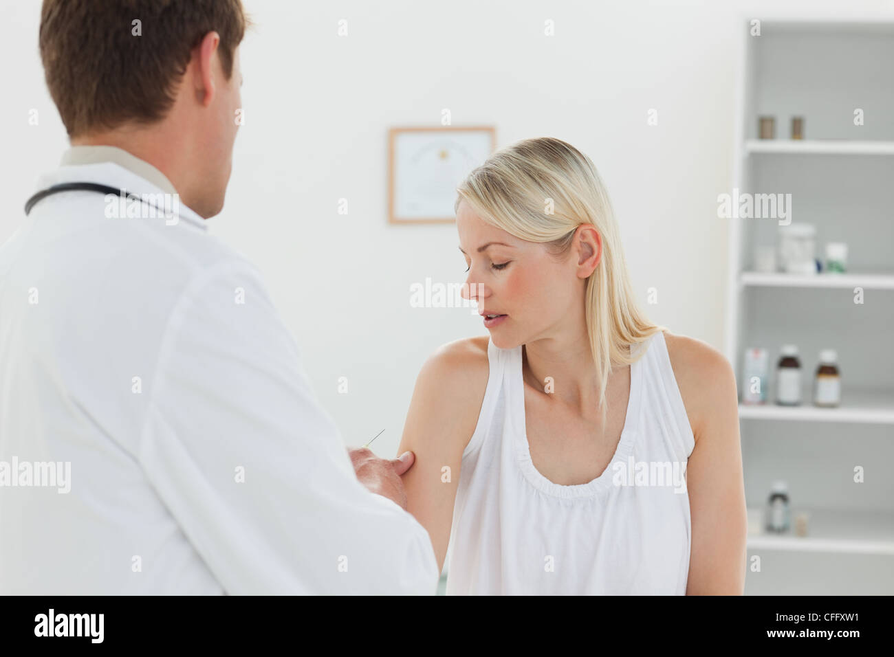 Doctor giving his patient an injection Stock Photo - Alamy