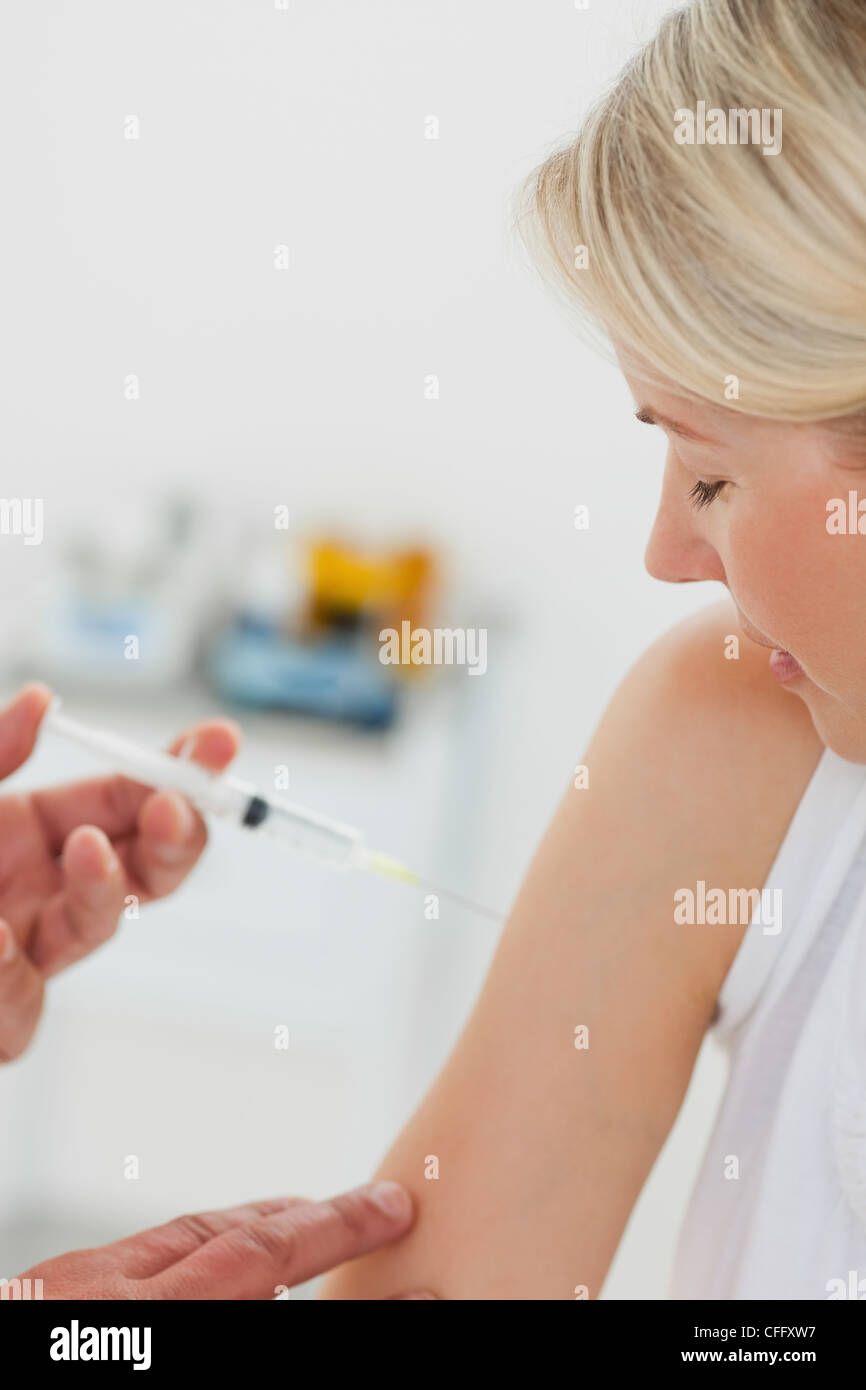 Close up of woman getting an injection Stock Photo - Alamy
