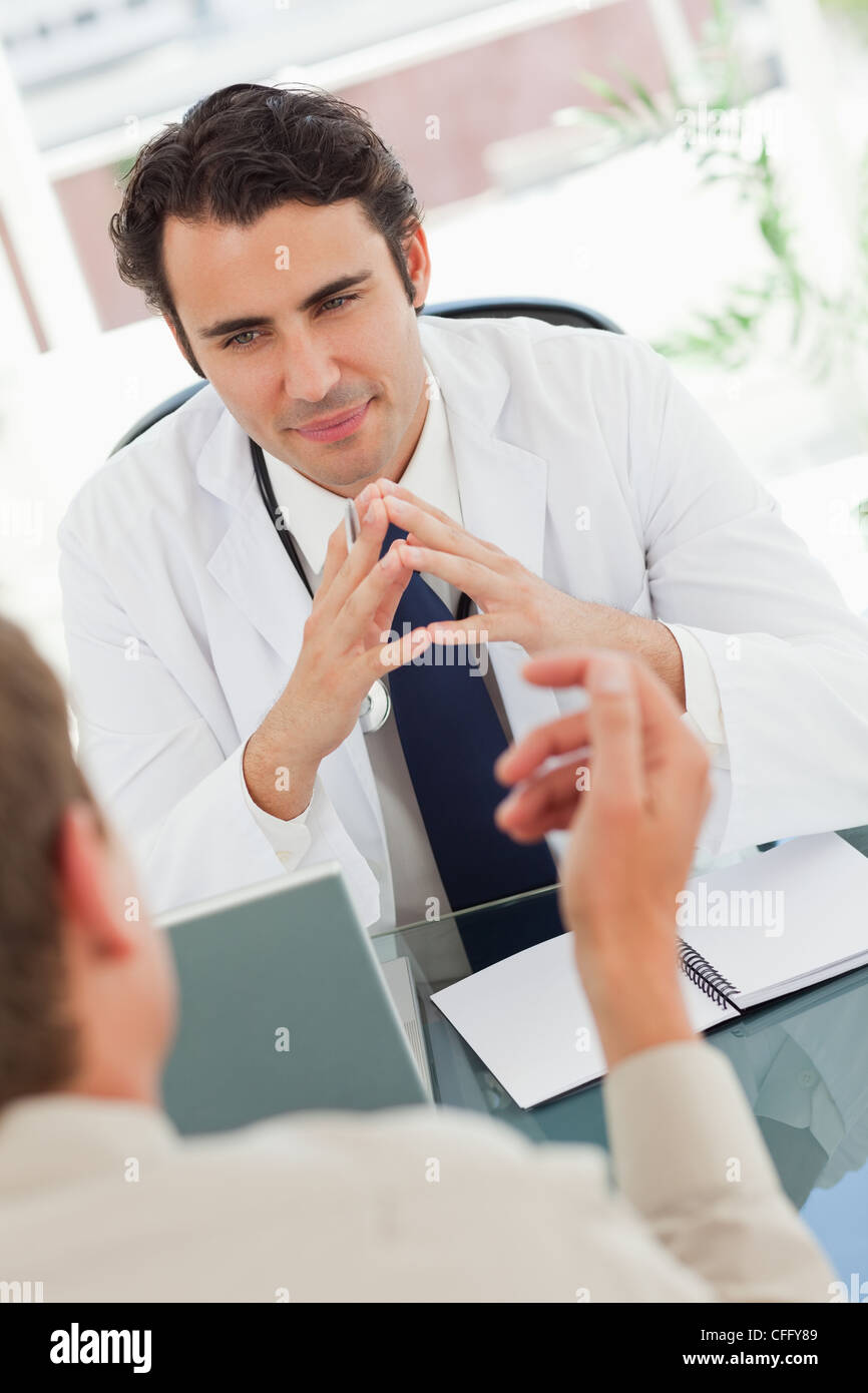 Doctor listening to patient Stock Photo - Alamy