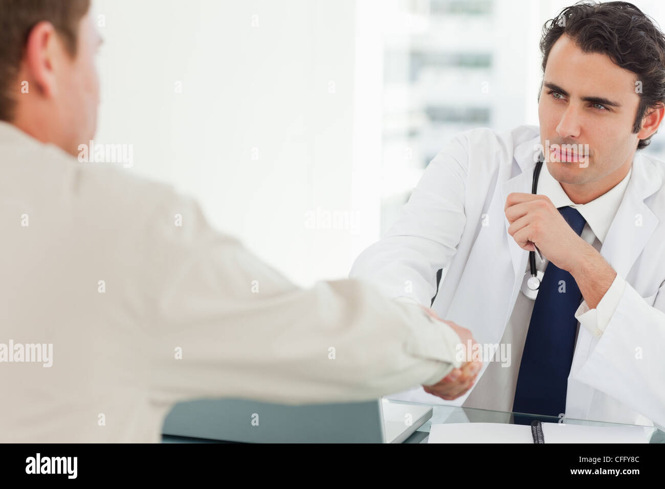 Doctor shaking his patients hand Stock Photo - Alamy