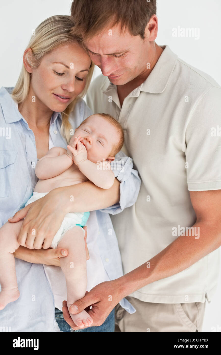 Mother and father with their baby Stock Photo - Alamy