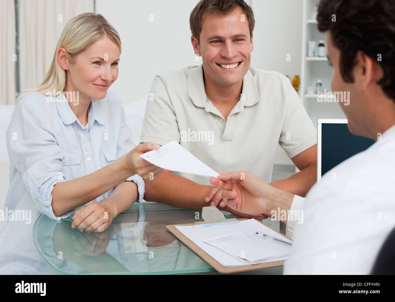 Happy female doctor giving hi-res stock photography and images - Alamy
