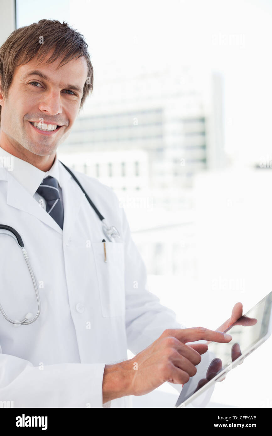 Doctor standing in front of a computer hi-res stock photography and ...