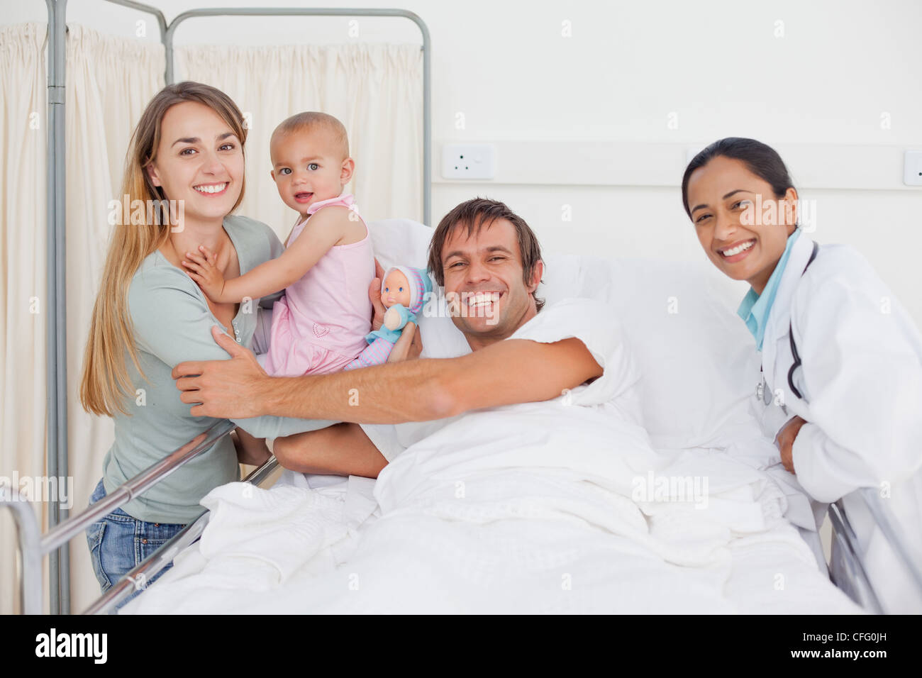 Hospital Room With Patient And Family