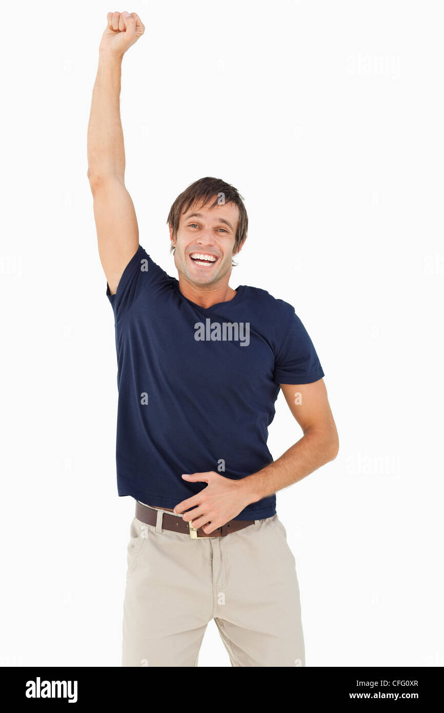 Successful man raising his fist above his head Stock Photo - Alamy