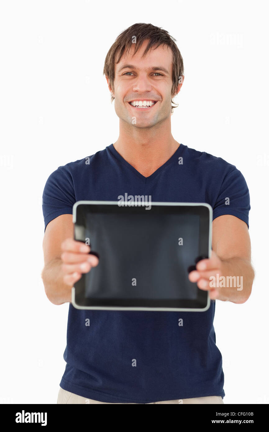 Tablet computer held by a young man Stock Photo - Alamy