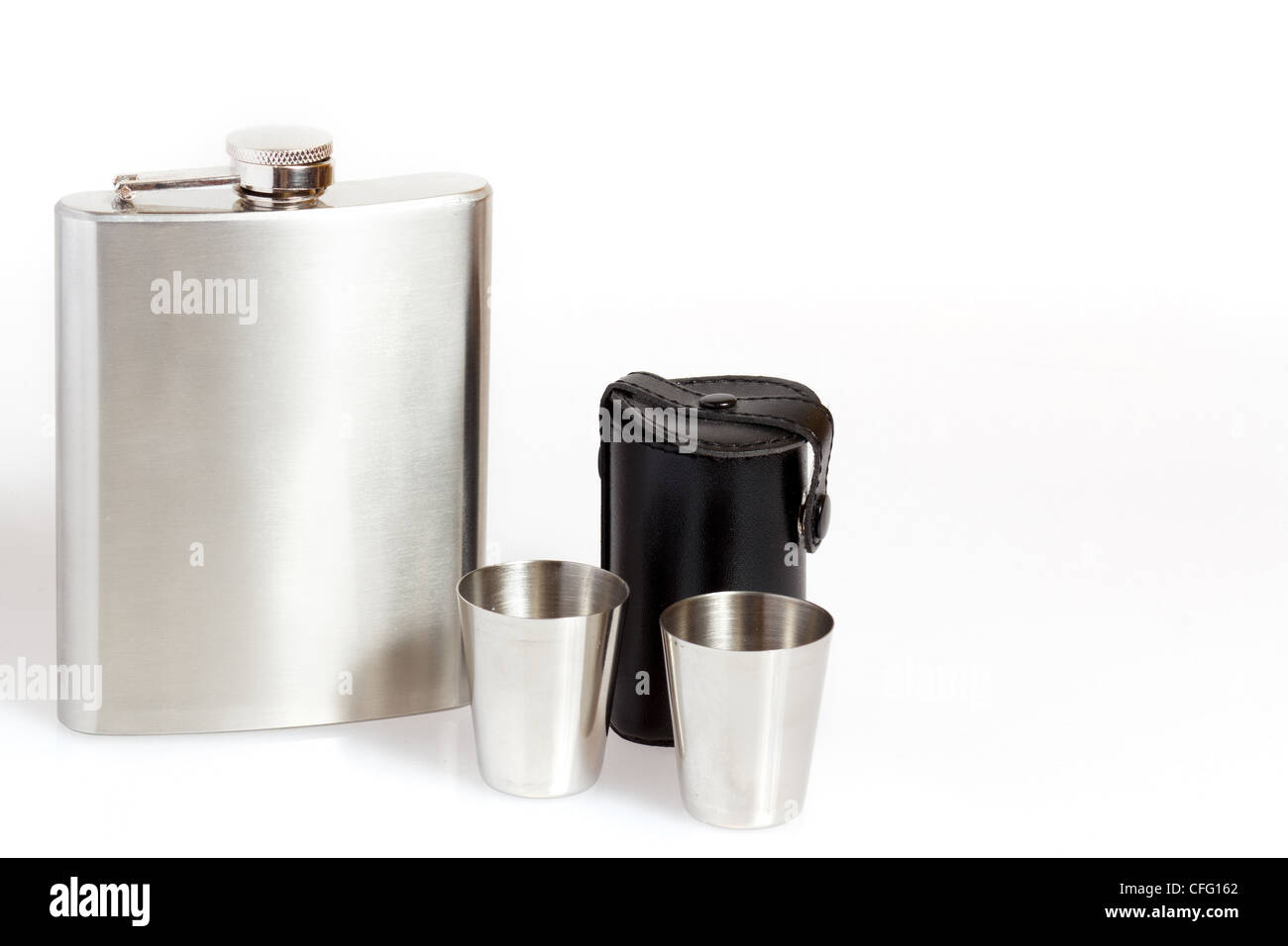 Hip flask and cups on white background Stock Photo - Alamy