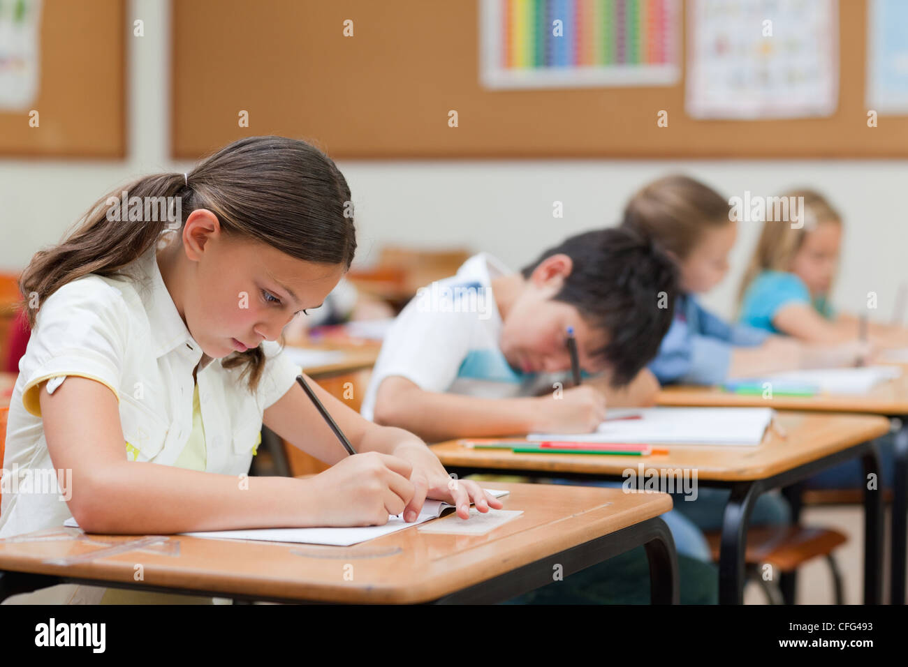 Side view of students doing exercises Stock Photo - Alamy