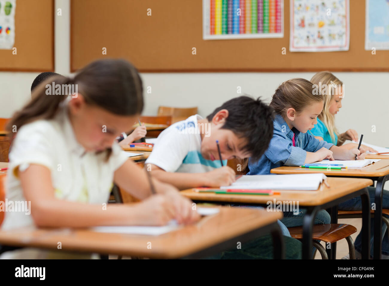 Side view of students doing exercises during class Stock Photo - Alamy