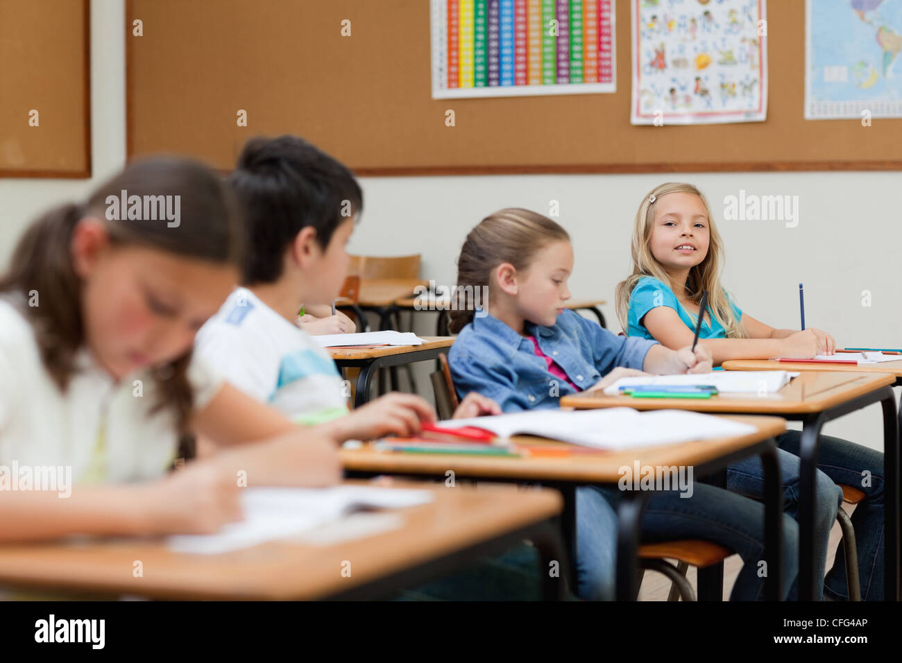 Side view caucasian schoolgirl sitting hi-res stock photography and ...