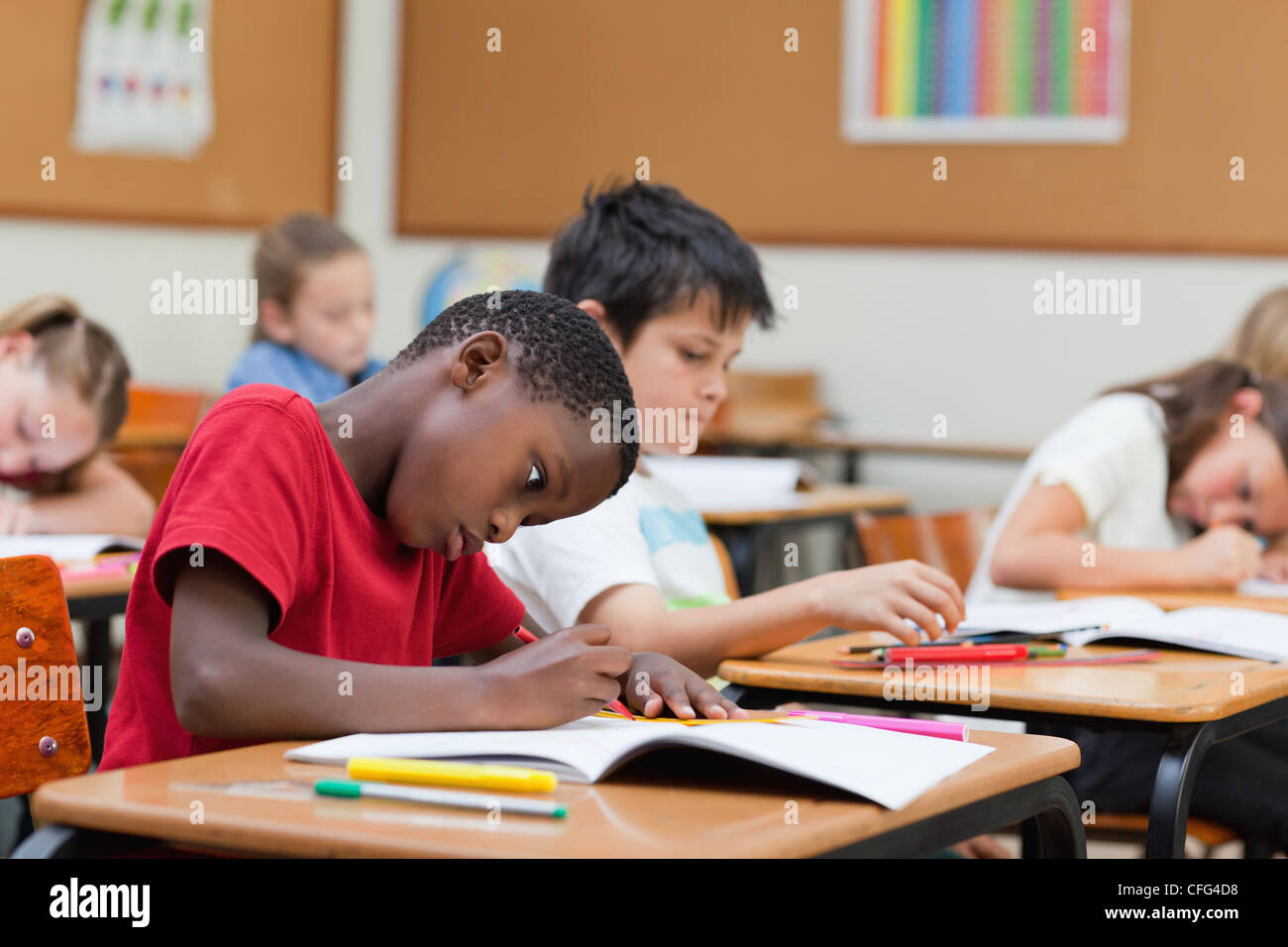 Side view of focused working student Stock Photo - Alamy