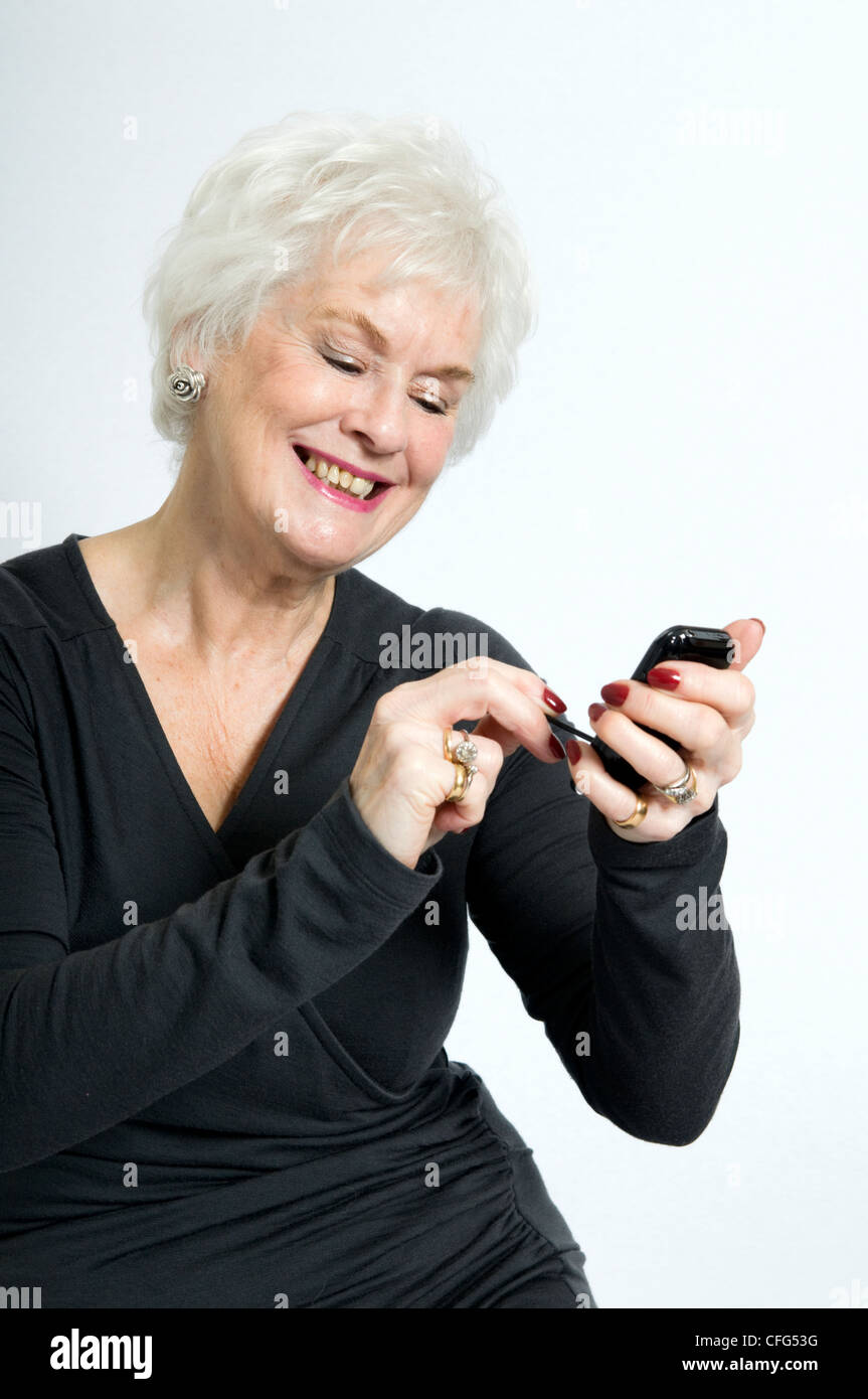 Oap using a mobile phone hi-res stock photography and images - Alamy