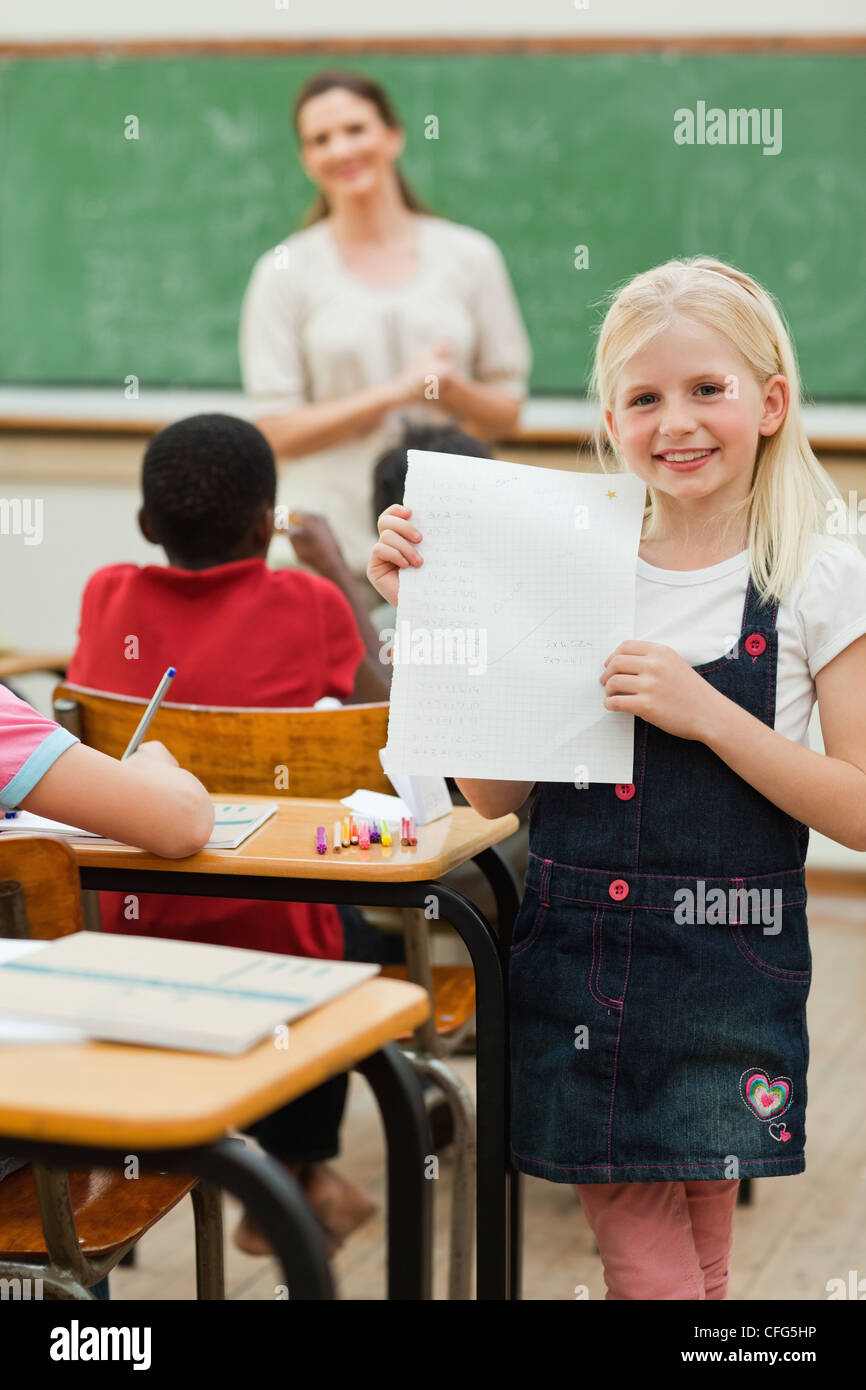 Smiling girl showing her test results Stock Photo - Alamy