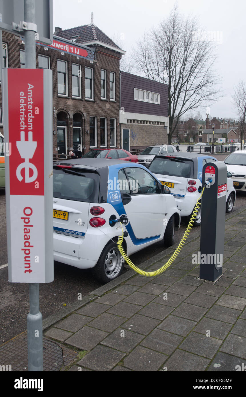 Electric Smart car in Amsterdam being charged on the side of road Stock ...