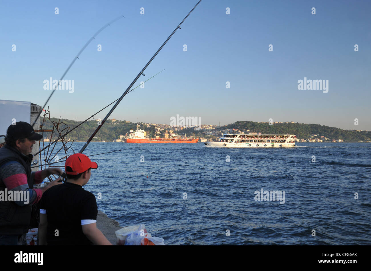 Men fish in the Bosphorus at Ortakoy Istanbul, Turkey Stock Photo - Alamy
